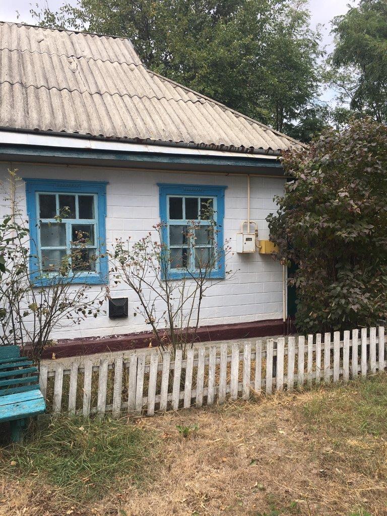 Traditional Ukrainian cottage with fruit trees